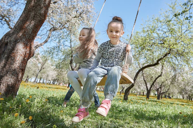 Happy Family Having Fun in the Spring Garden Stock Photo - Image of ...