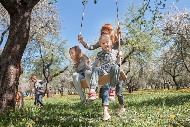 Happy Family Having Fun in the Spring Garden Stock Photo - Image of ...
