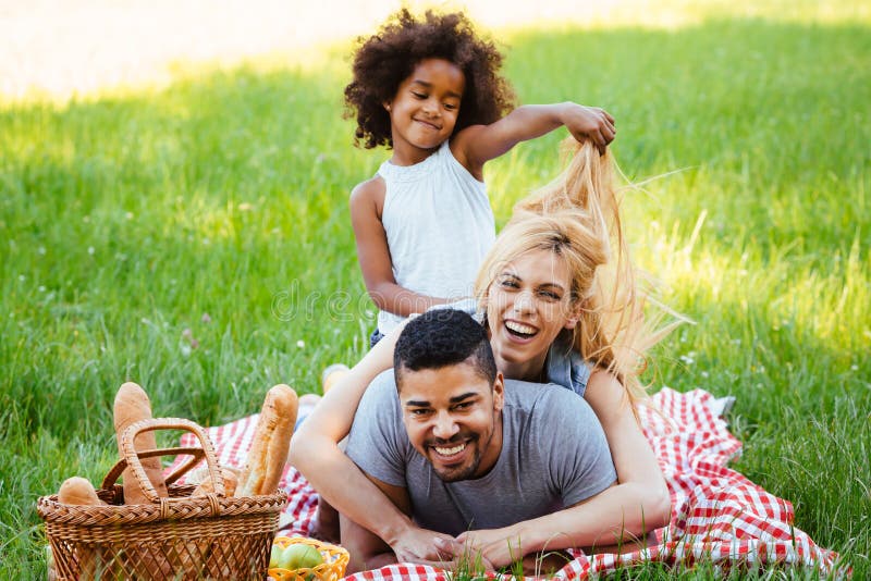 Happy Family Having Fun Time on Picnic Stock Photo - Image of grass ...