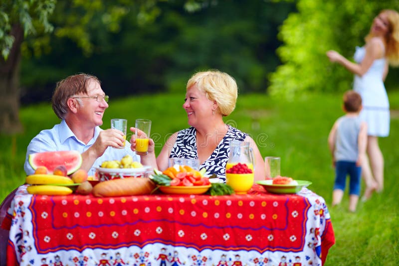 Happy Family Having Picnic Outdoors Stock Photo - Image of happy ...