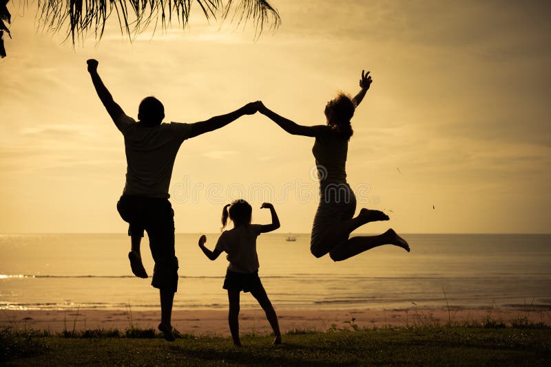 Happy Family Jumping on the Beach Stock Image - Image of back, daughter ...