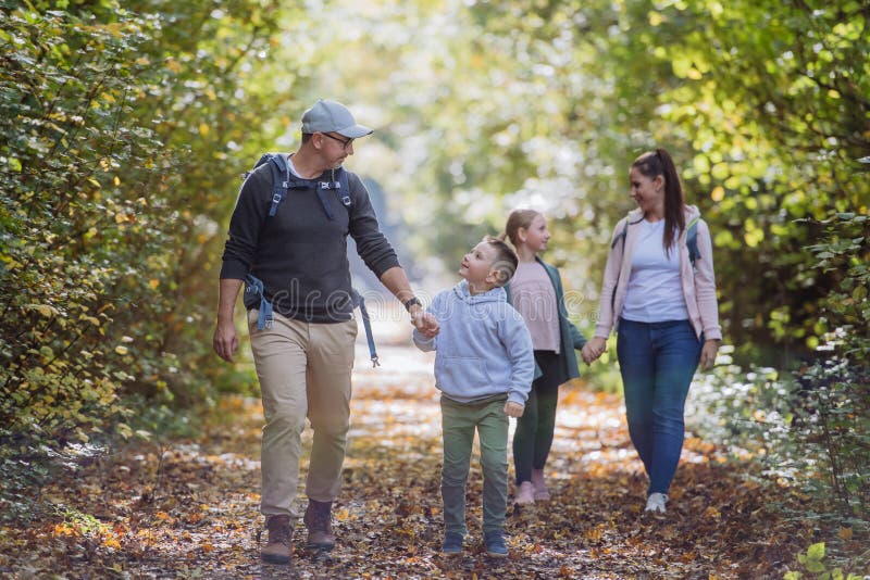 Happy Family with Kids Walking in Forest. Stock Photo - Image of forest ...