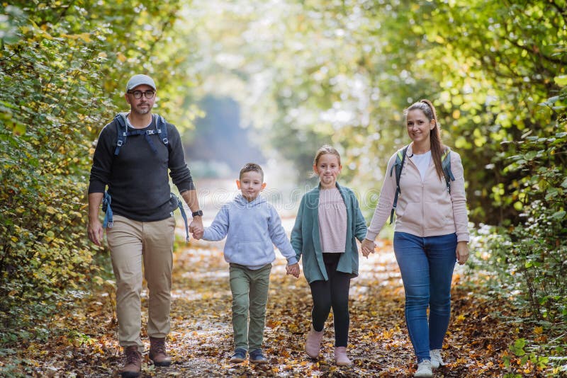 Happy Family with Kids Walking in Forest. Stock Image - Image of ...