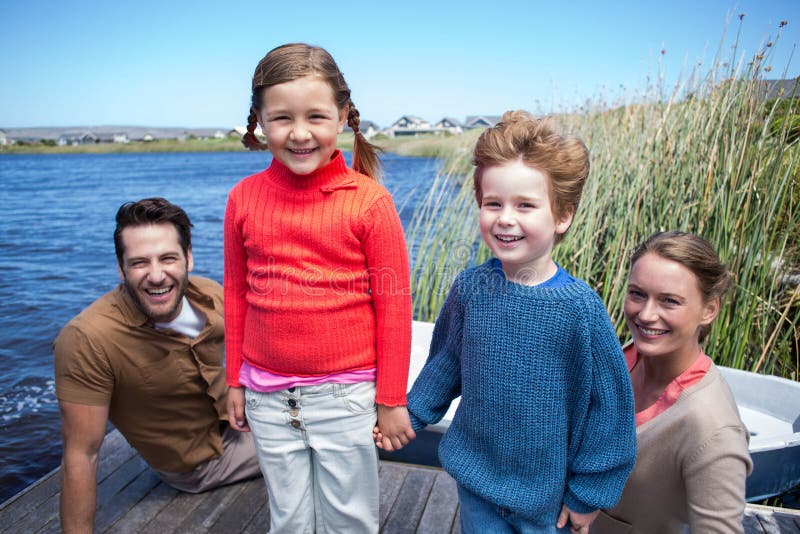 Happy family at a lake stock photo. Image of affection - 51697312