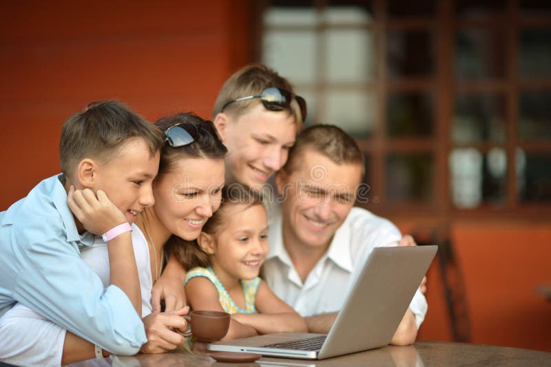 Happy family with laptop stock photo. Image of person - 69704018