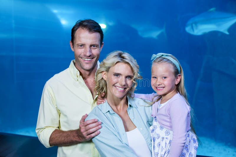Happy Family Looking at Camera beside the Fish Tank Stock Photo - Image ...
