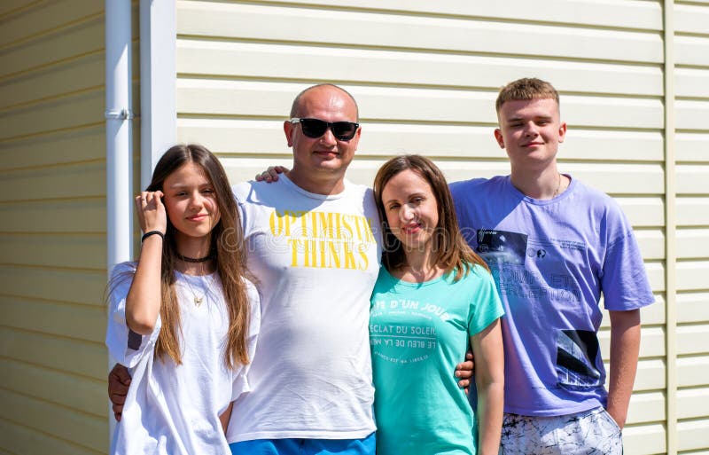 A Happy Family, Mom, Dad, Daughter and Son. Stock Photo - Image of ...