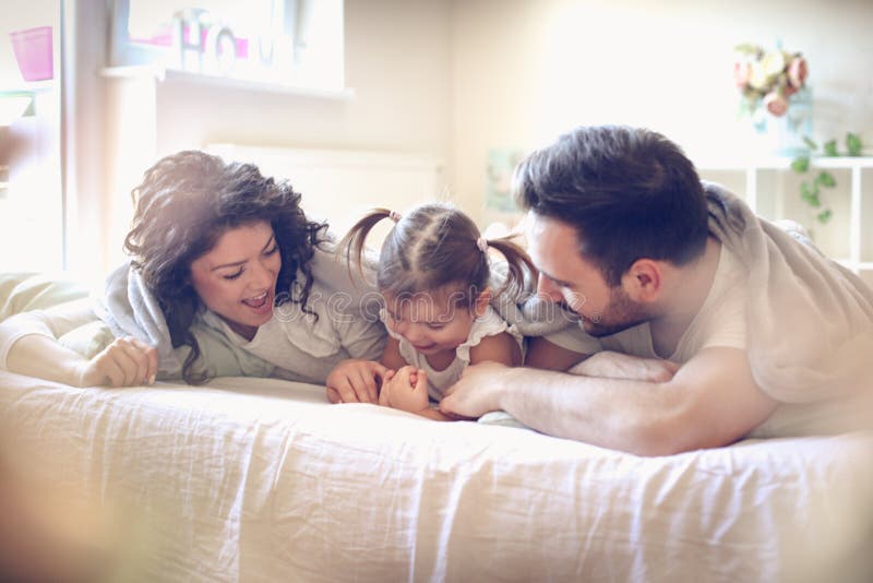 Happy family at morning. stock image. Image of happiness - 120957513