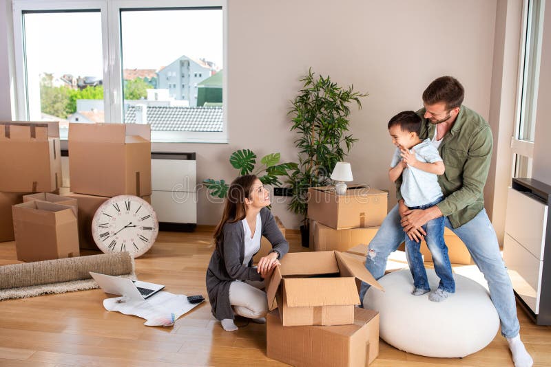Happy Family Moving in and Having Fun Stock Image - Image of indoors ...