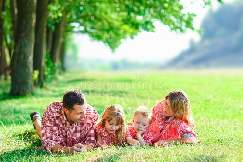 Happy family in nature stock image. Image of father - 219064933