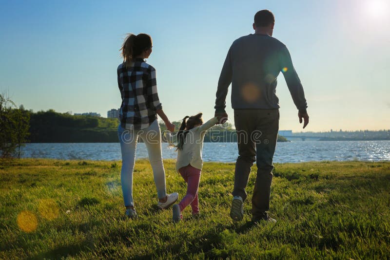 Happy Family Near River on Spring Day Stock Image - Image of happy ...