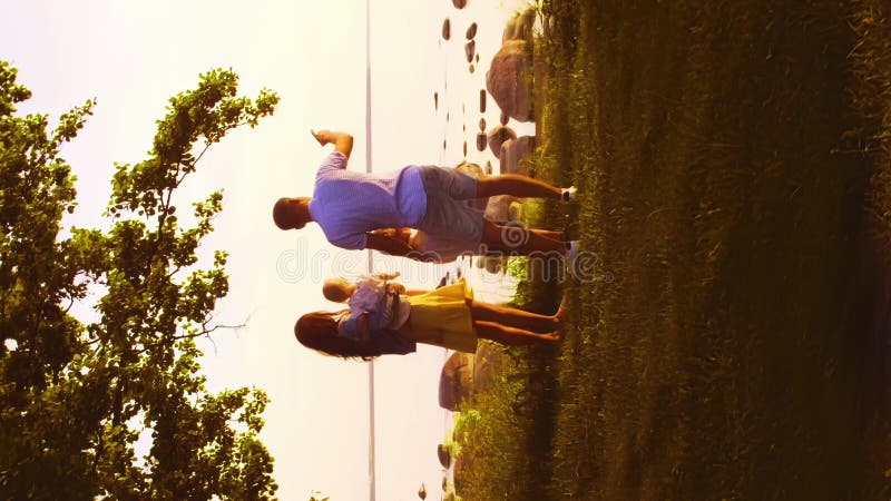Happy Family Near the Sea. Field and Trees in Countryside. Warm Colors ... Happy Family Near the Sea. Field and Trees in Countryside. Warm Colors ...