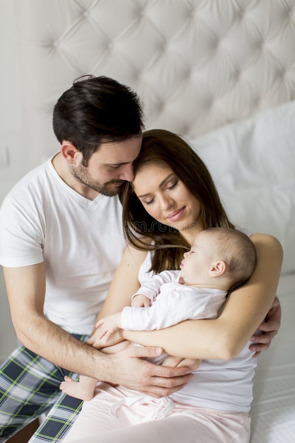 Happy Family with Newborn Baby Stock Photo - Image of home, room: 67752648