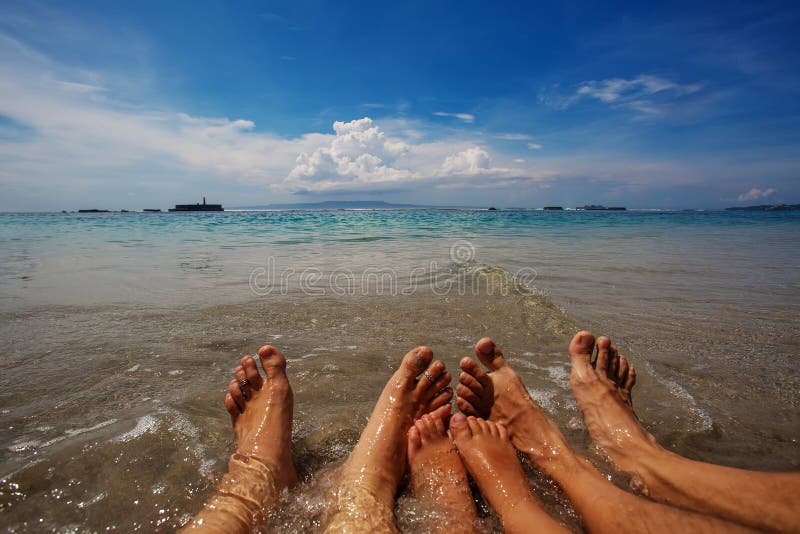 Happy family by the ocean stock image. Image of daughter - 175453741