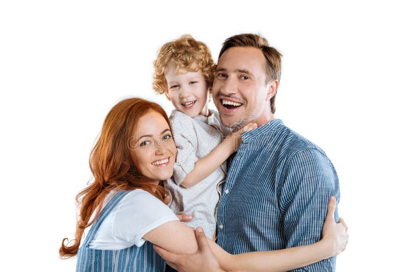 Happy Family with One Child Hugging and Smiling at Camera Stock Photo ...