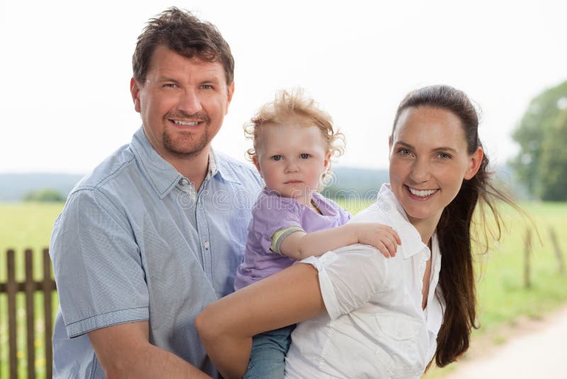Happy Family Outdoor in a Park Stock Image - Image of portrait, adult ...