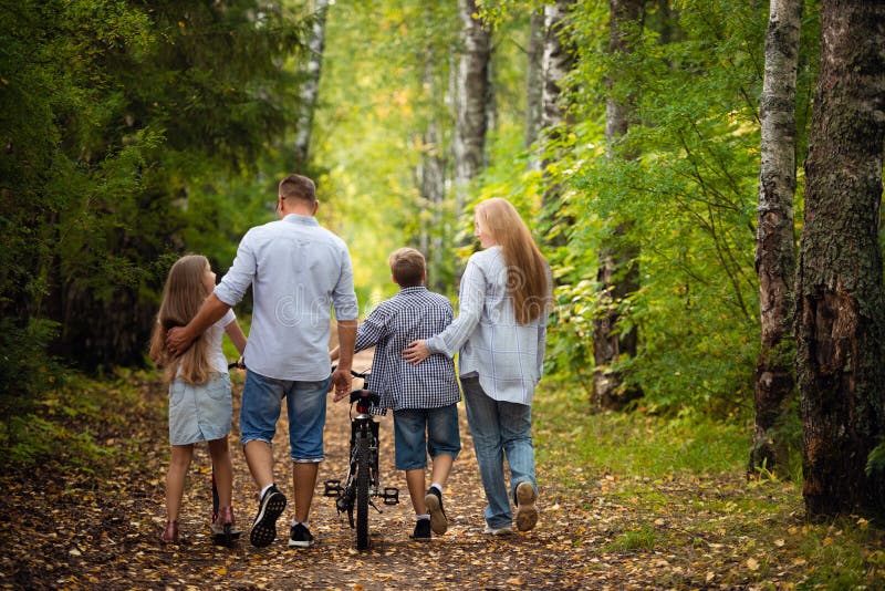 Happy Family Outdoors Smiling in a Summer Forest Stock Photo - Image of ...