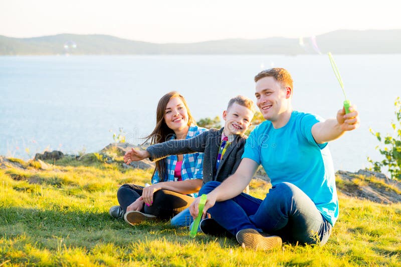 Happy family outside stock photo. Image of nice, spring - 101572468