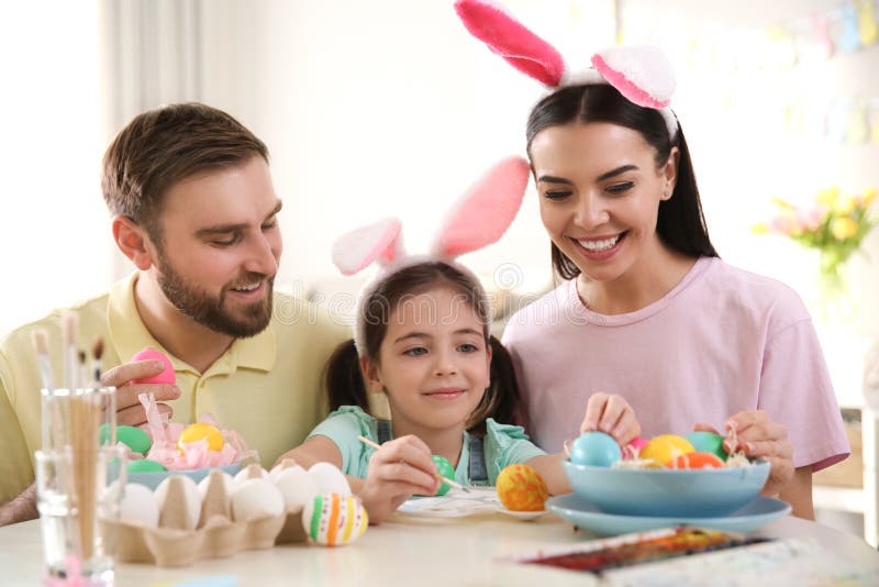 Happy Family Painting Easter Eggs at Table Indoors Stock Photo - Image ...