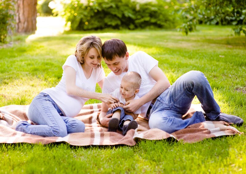 Happy family in park stock photo. Image of park, green - 53998166