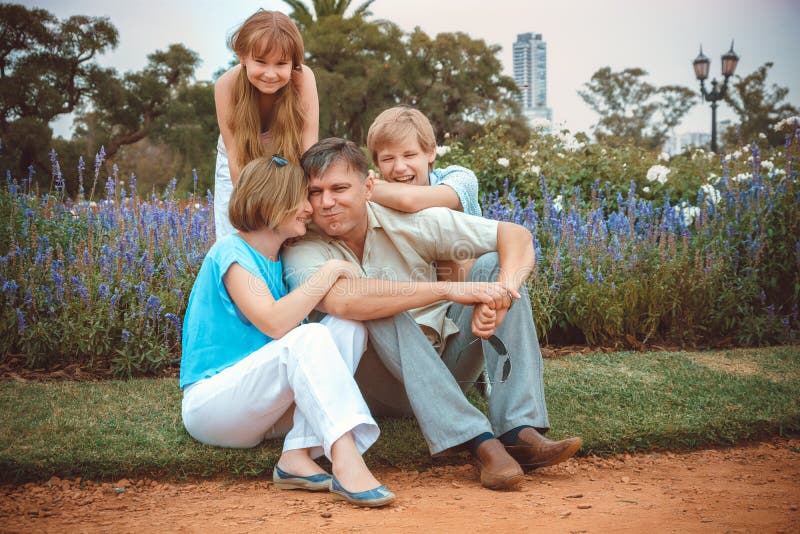 Happy family in park stock photo. Image of family, female - 97916050