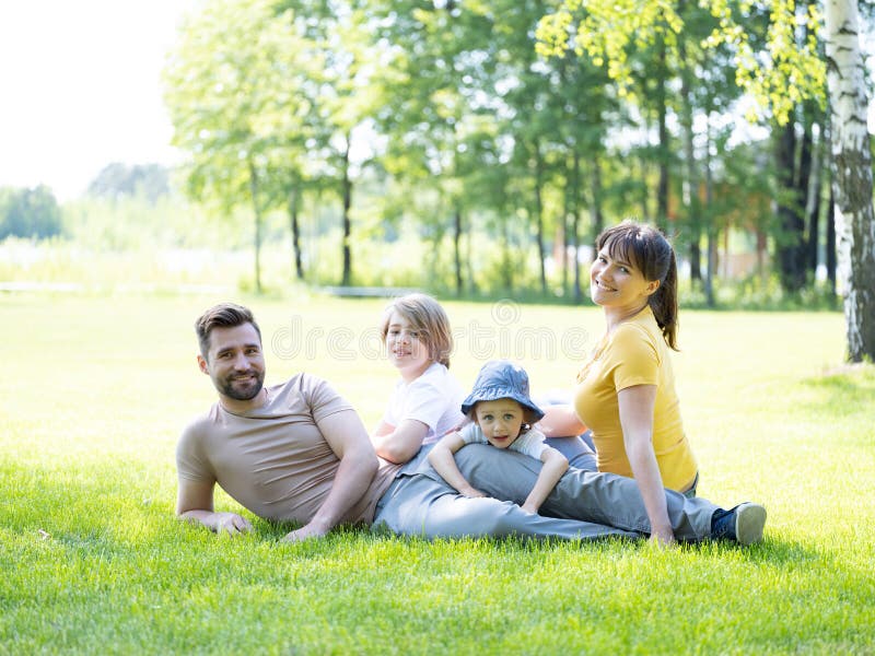 Happy family in park stock image. Image of caucasian - 259762903