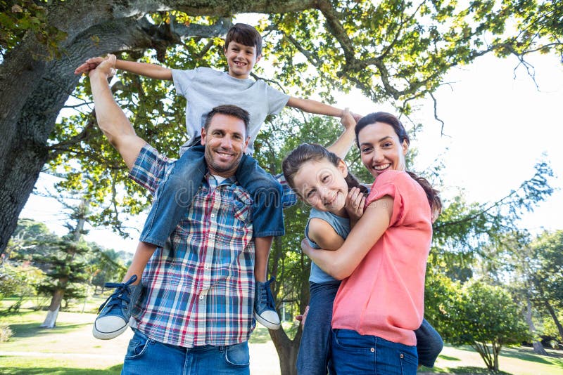 Happy Family in the Park Together Stock Image - Image of outdoors ...