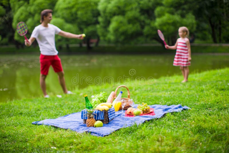 Happy Family Picnicking in the Park Stock Image - Image of basket ...
