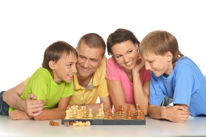 Happy family playing chess stock image. Image of intelligence - 38400653