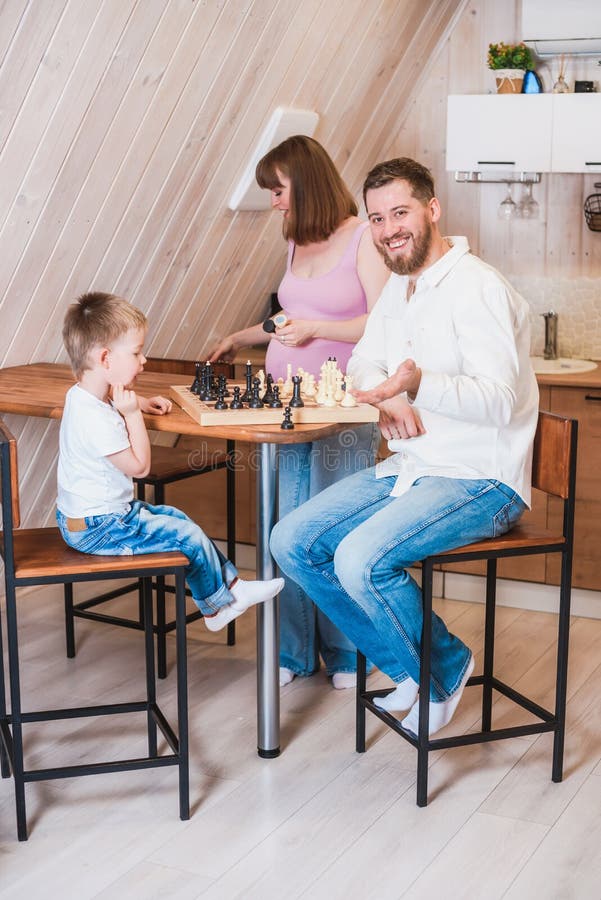 Happy Family Playing Chess in the Kitchen Stock Photo - Image of ...