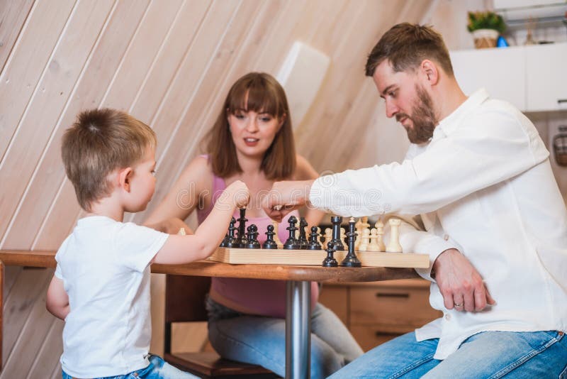 Happy Family Playing Chess in the Kitchen Stock Photo - Image of ...
