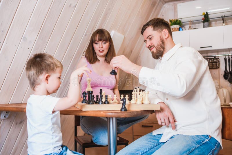 Happy Family Playing Chess in the Kitchen Stock Photo - Image of male ...