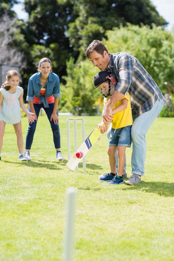 Happy Family Playing Cricket Together Stock Photo - Image of girl ...