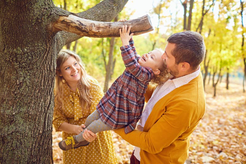 Happy Family Playing in the Park in the Fall. Stock Image - Image of ...