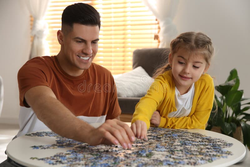 Happy Family Playing with Puzzles at Home Stock Image - Image of adult ...
