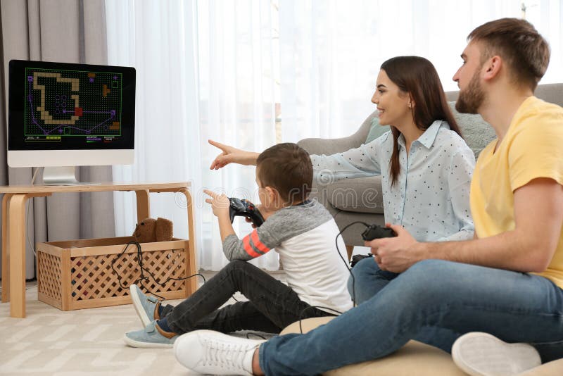 Happy Family Playing Video Games at Home Stock Image - Image of carpet ...