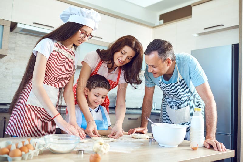 A Happy Family Prepares Baking in the Kitchen Stock Image - Image of ...