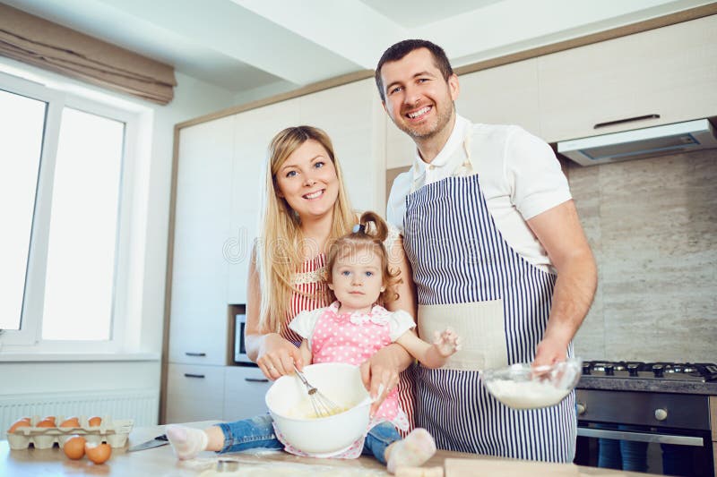 A Happy Family Prepares Baking in the Kitchen Stock Image - Image of ...