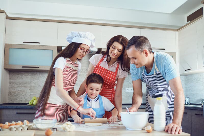 A Happy Family Prepares Baking in the Kitchen Stock Image - Image of ...