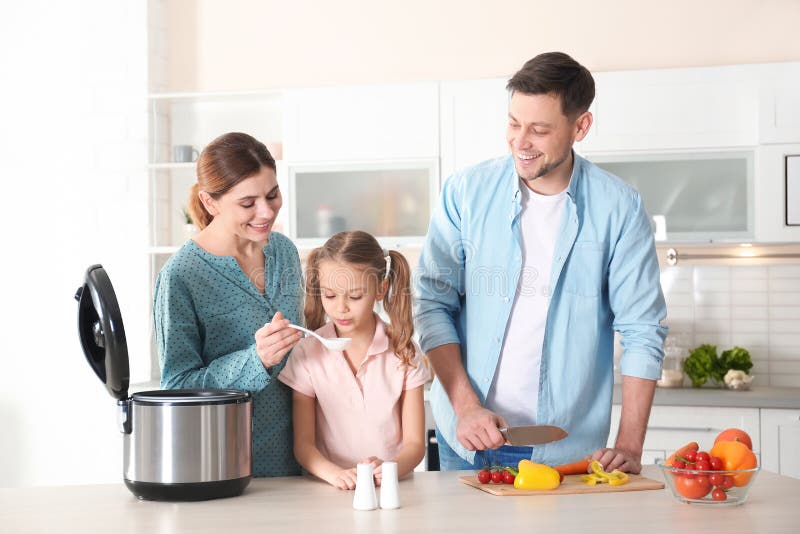 Happy Family Preparing Food with Modern Multi Cooker Stock Image ...