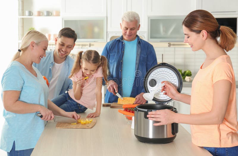 Happy Family Preparing Food with Modern Multi Cooker Stock Image ...