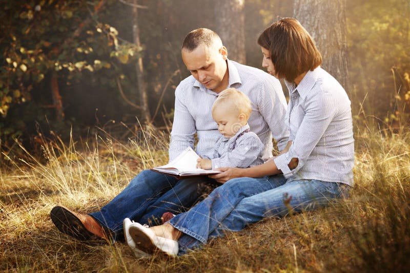 Young Man Reading Bible To Child Stock Image - Image of nature ...