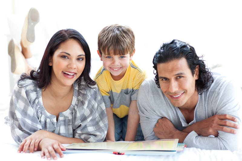 Happy Family Reading Book Together Stock Photo - Image of attractive ...