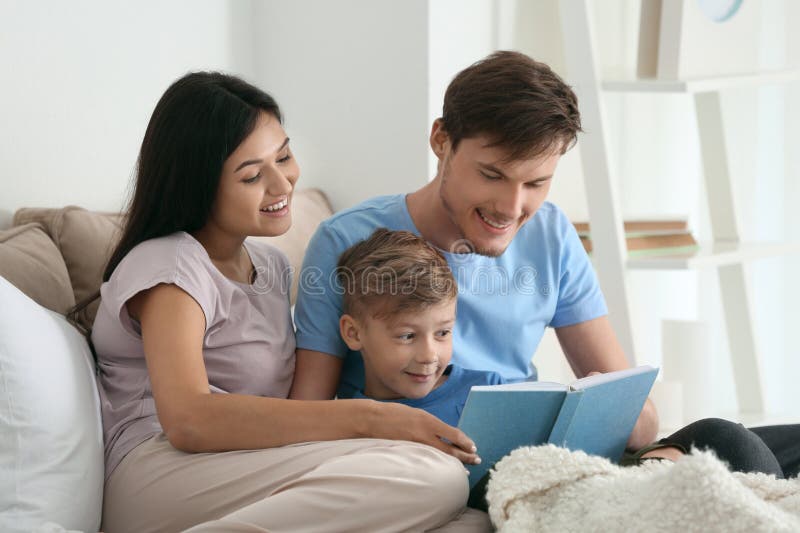 Happy Family Reading Book Together at Home Stock Photo - Image of home ...