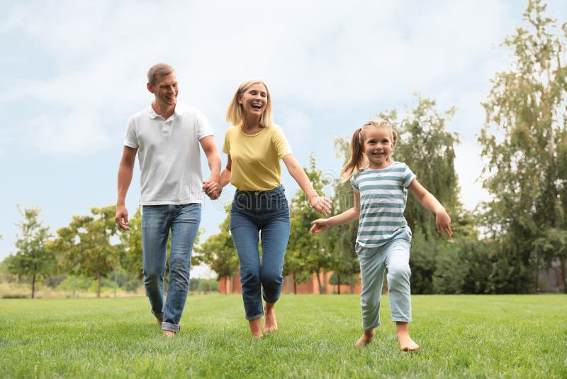 Happy Family Running in Park on Summer Day Stock Image - Image of happy ...