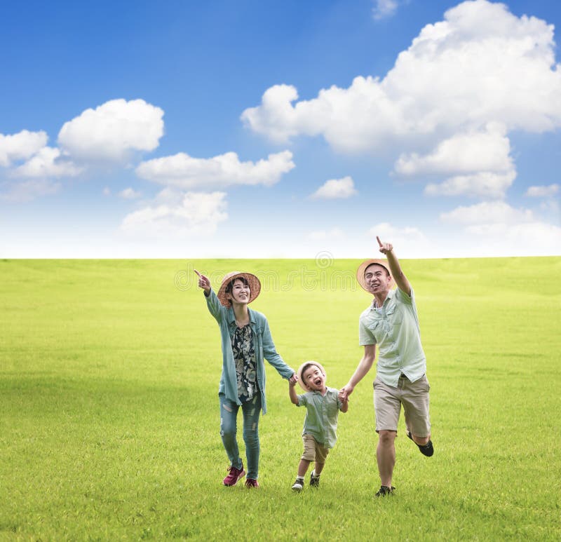 Happy Family Running Together on the Grass Stock Image - Image of asian ...