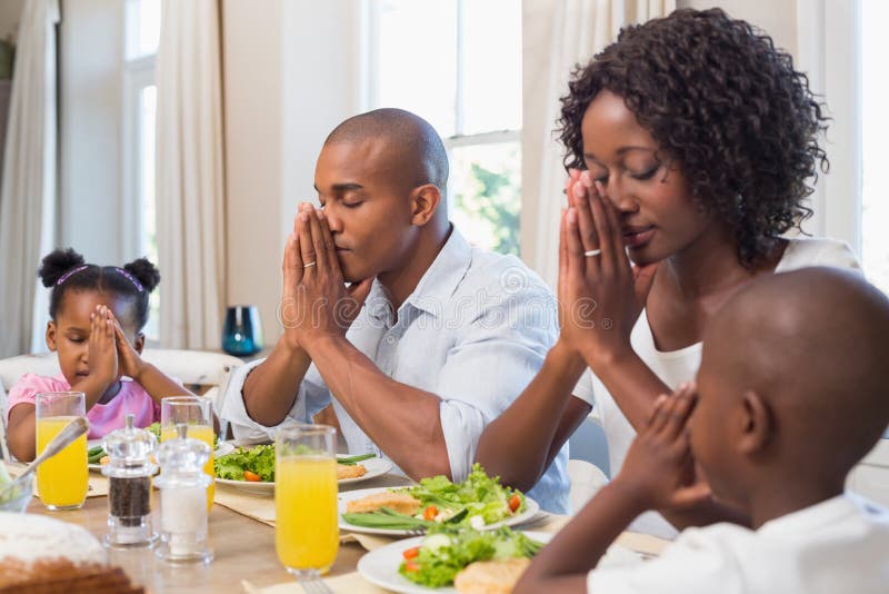 Family Saying Grace before Dinner Stock Photo - Image of handsome, girl ...