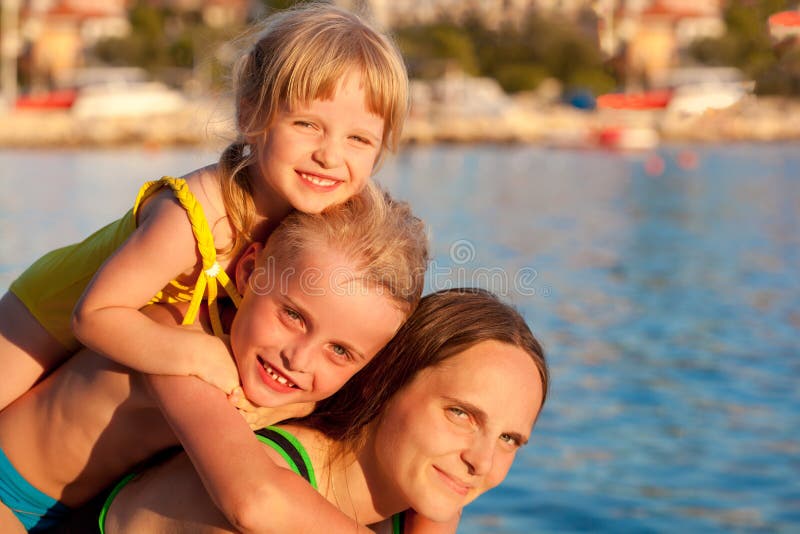 Happy family by the sea stock image. Image of lifestyle - 26188685