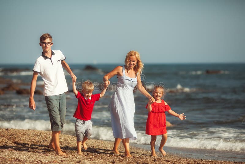 Happy family at the sea stock image. Image of family - 180693813