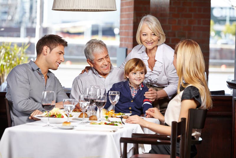 Happy Family Sitting in Restaurant Stock Photo - Image of hotel ...